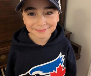 Eight-Year-Old Logan Dorna Celebrates Blue Jays with Unique Prosthetic Eye